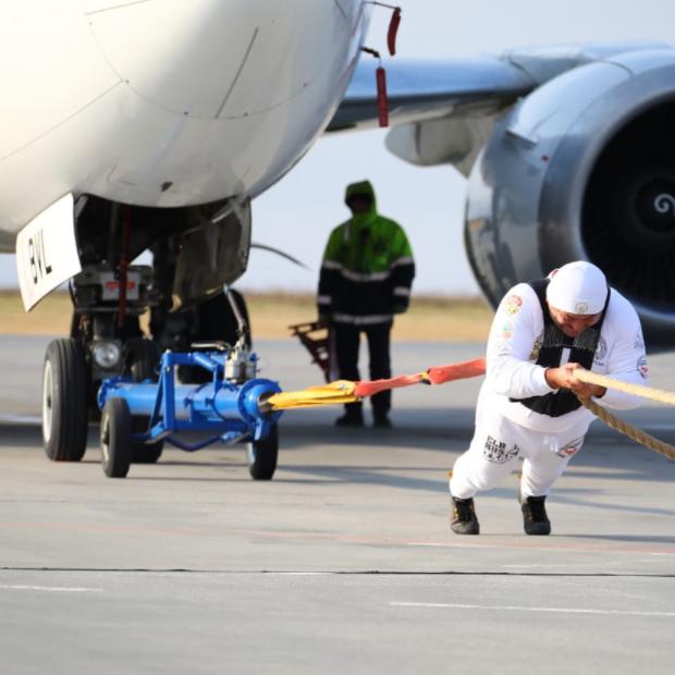Russian strongman sets ‘plane pull’ national record | Editorji